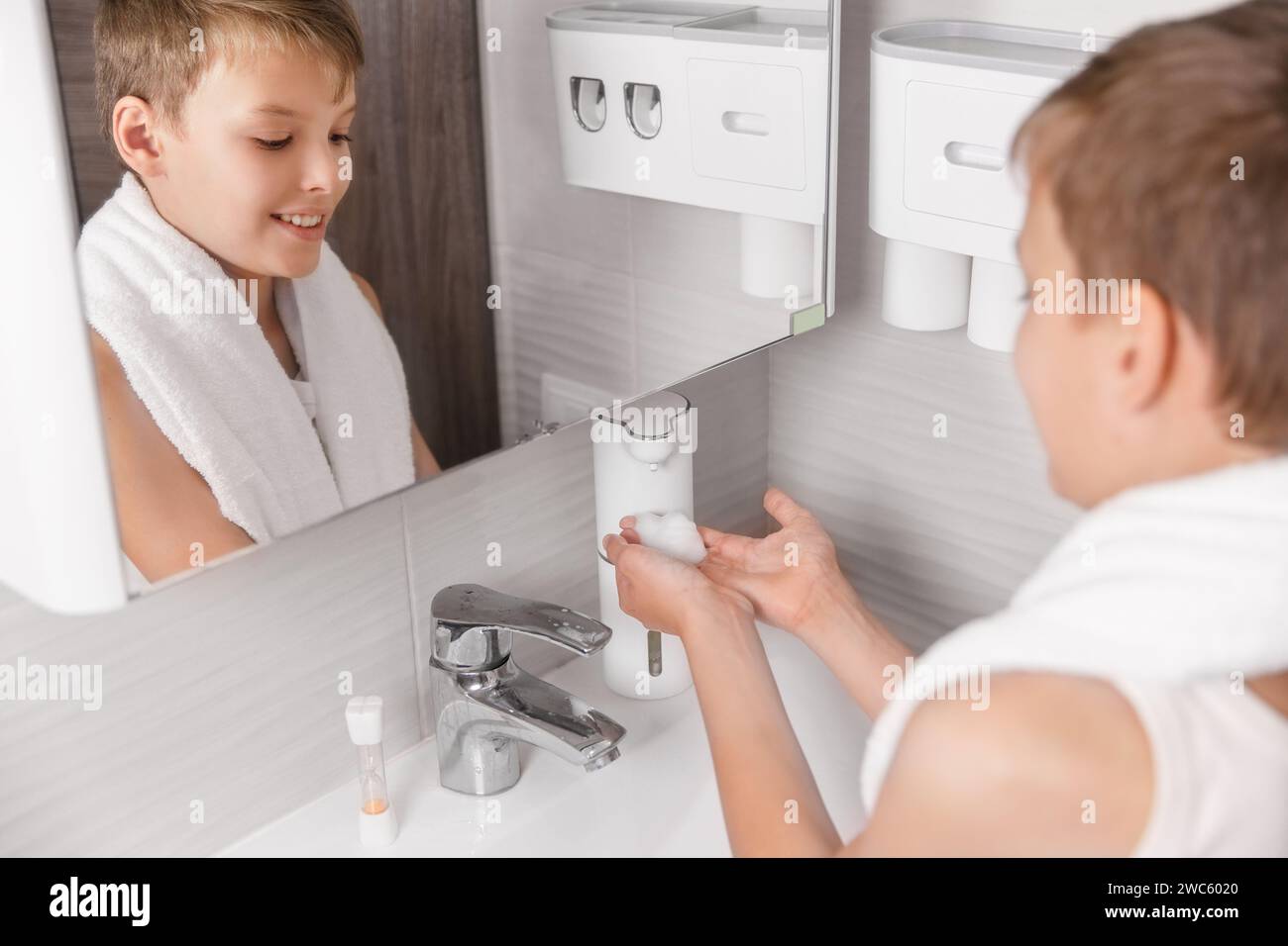 Teenage self-care: a refreshing moment in the bathroom Stock Photo - Alamy