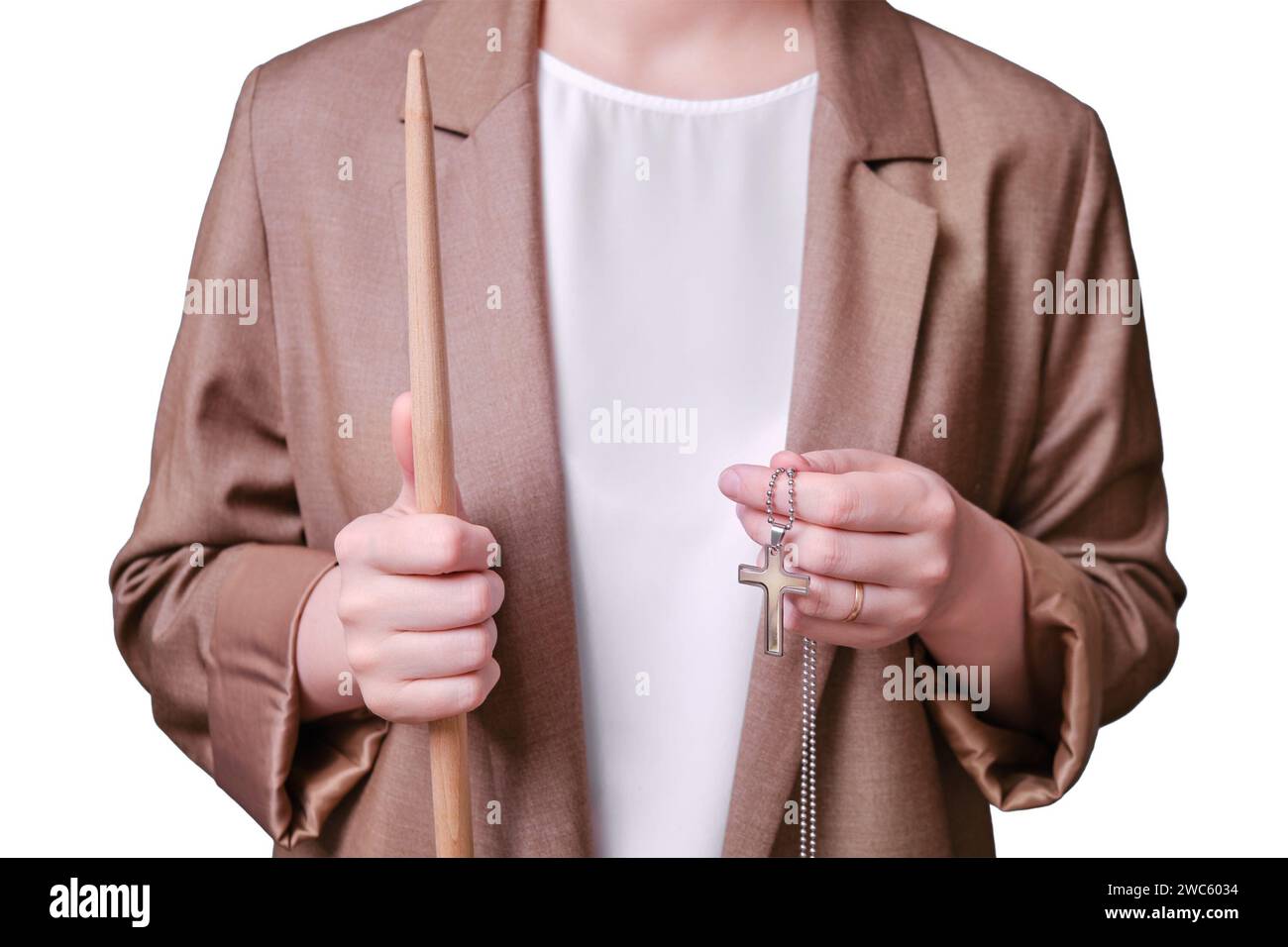 Woman teacher holding religious symbol catholic cross on studio ...