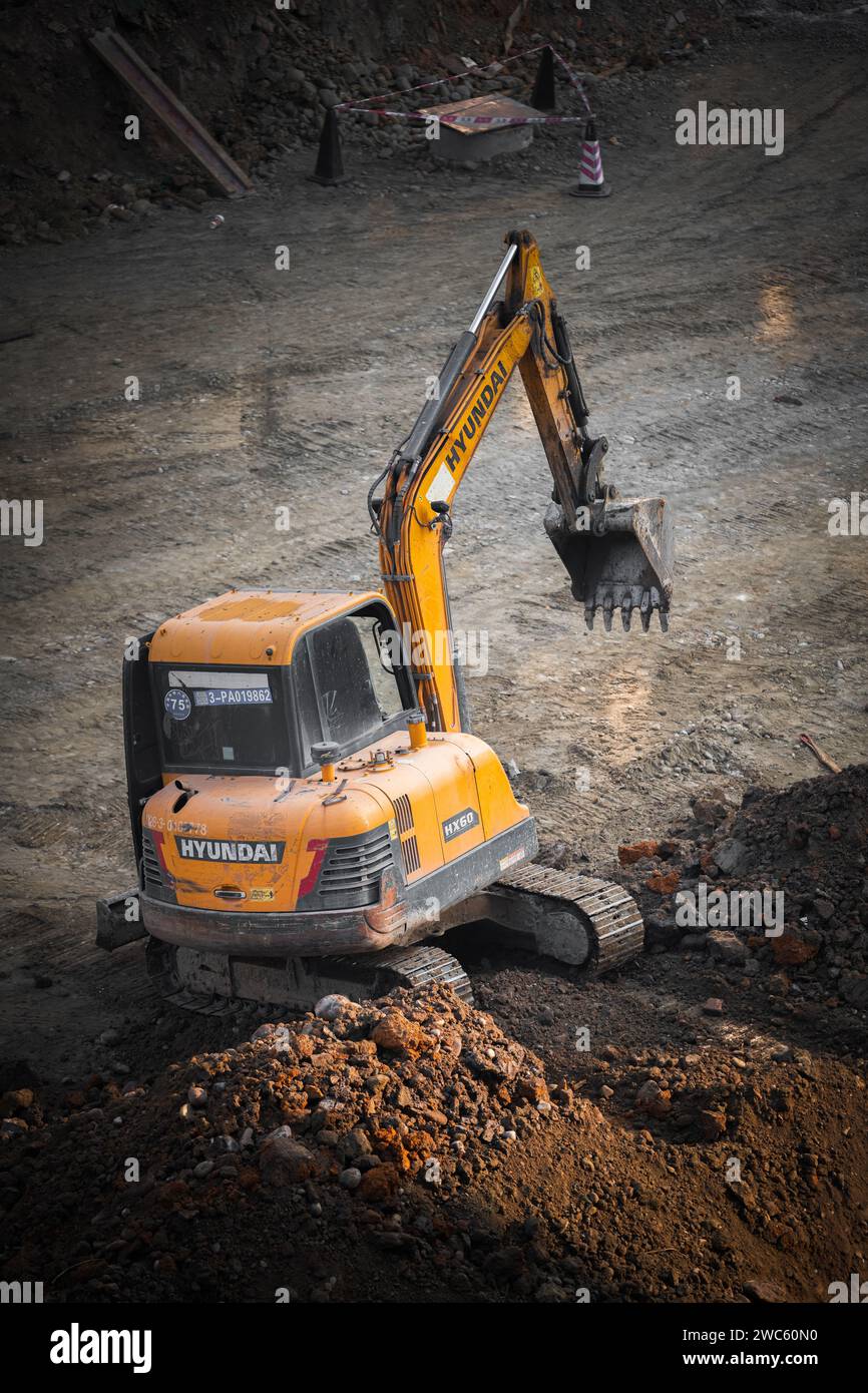 Excavator is digging and transporting items in the early morning Stock ...