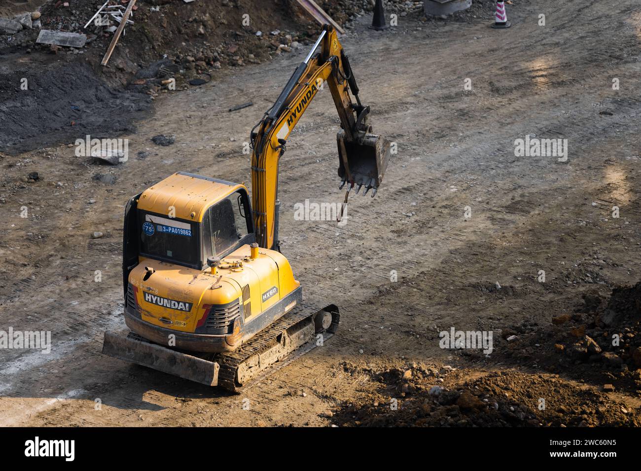Excavator is digging and transporting items in the early morning Stock ...