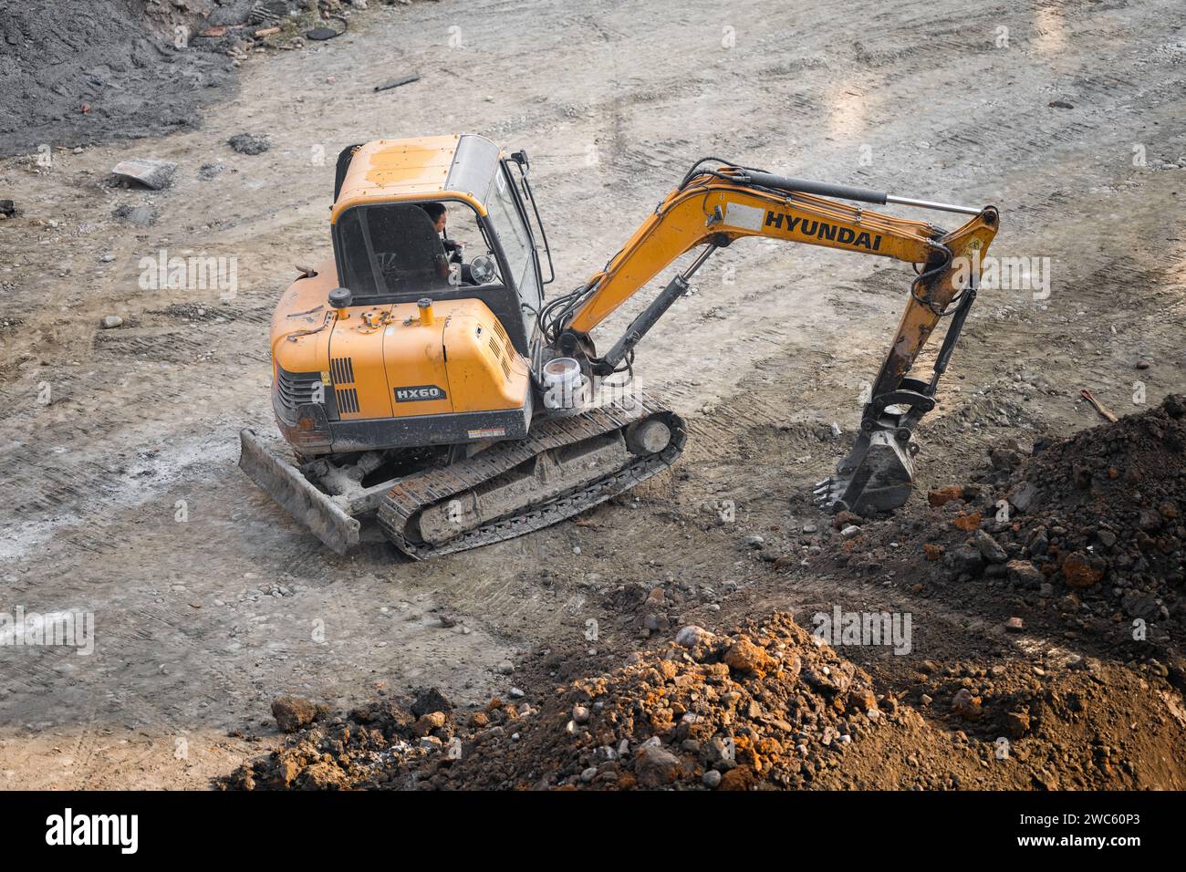 Excavator is digging and transporting items in the early morning Stock ...