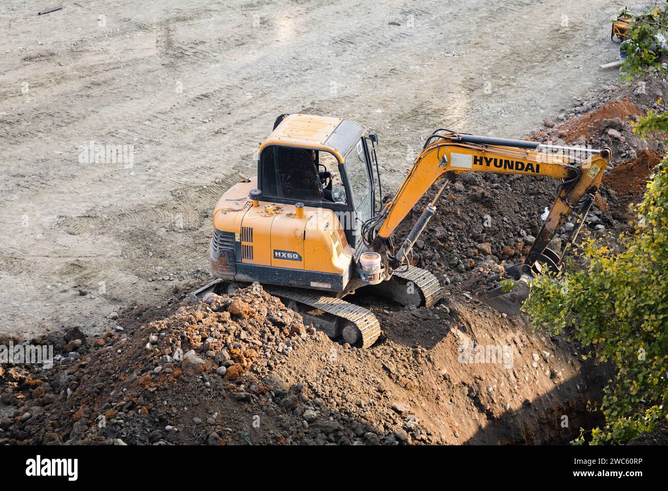 Excavator is digging and transporting items in the early morning Stock ...
