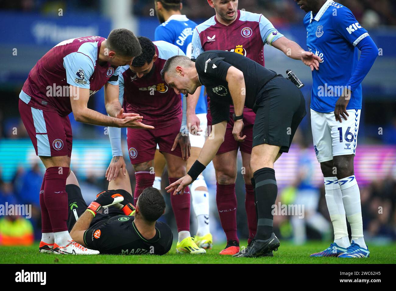 Aston Villa goalkeeper Emiliano Martinez reacts to an injury during the ...