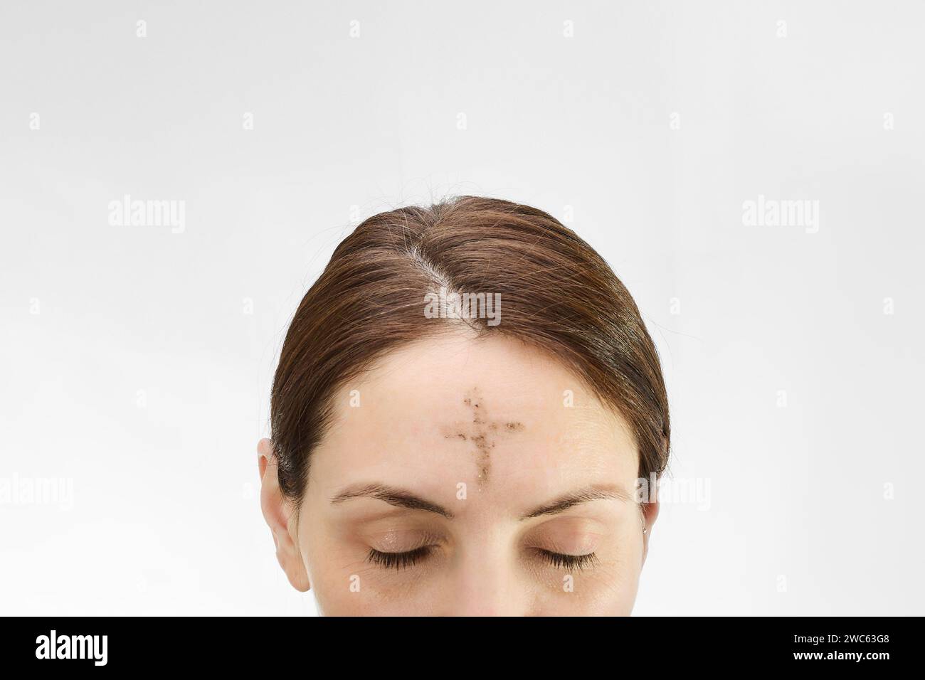 Woman with cross made from ash on forehead. Ash wednesday concept Stock ...