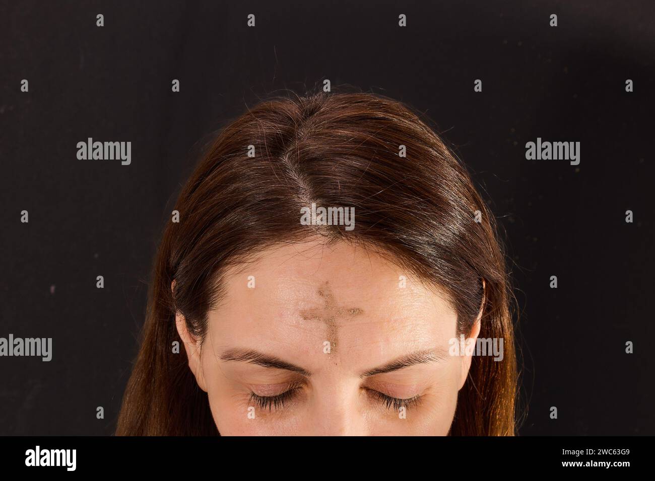 Woman with cross made from ash on forehead. Ash wednesday concept Stock ...