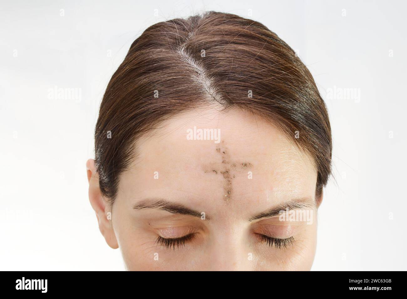 Woman with cross made from ash on forehead. Ash wednesday concept Stock ...