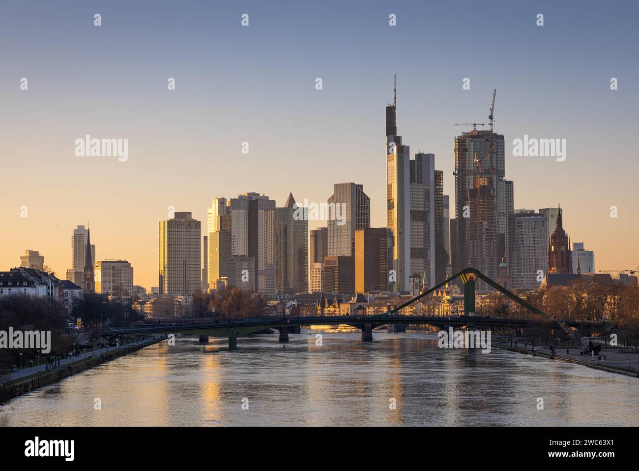 The light of the setting winter sun falls sideways onto the buildings ...