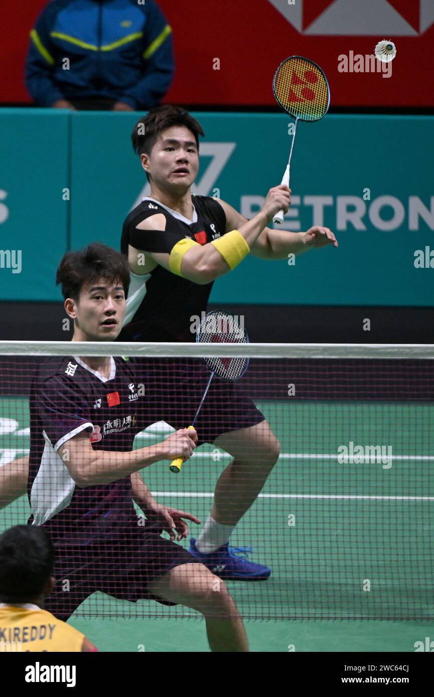 Kuala Lumpur, Malaysia. 14th Jan, 2024. Liang Weikeng(R)/Wang Chang of China compete during the ...
