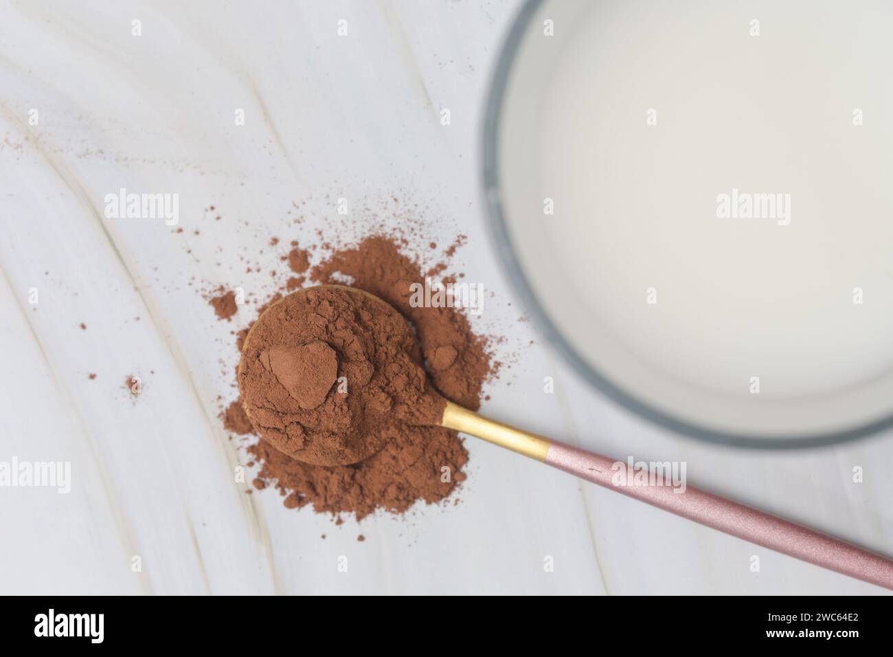 Unsweetened dark chocolate cacao powder in the spoon Stock Photo - Alamy