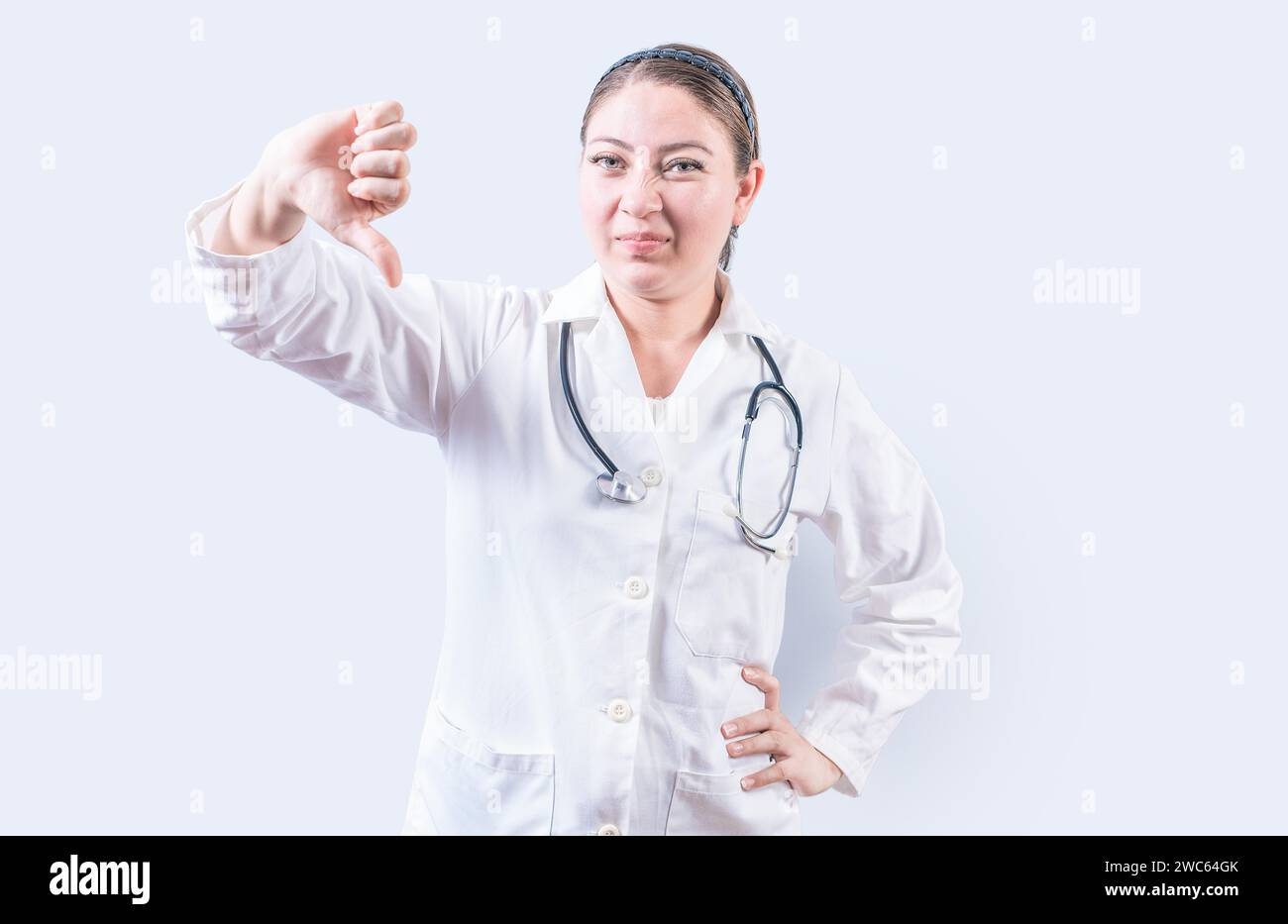 Female doctor gesturing disapproval isolated. Female doctor ...
