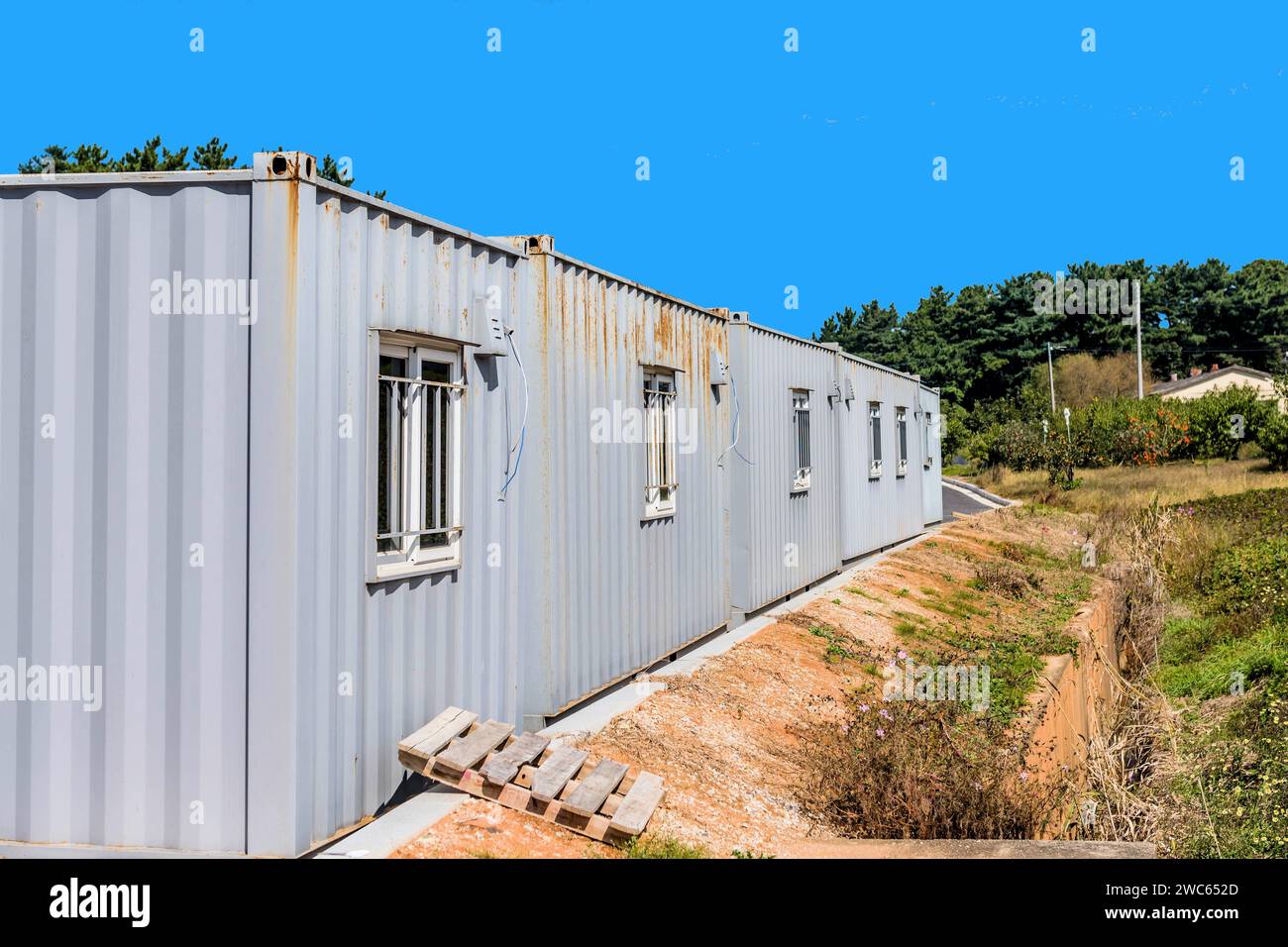 Portable corrugated metal storage buildings under clear blue sky Stock ...