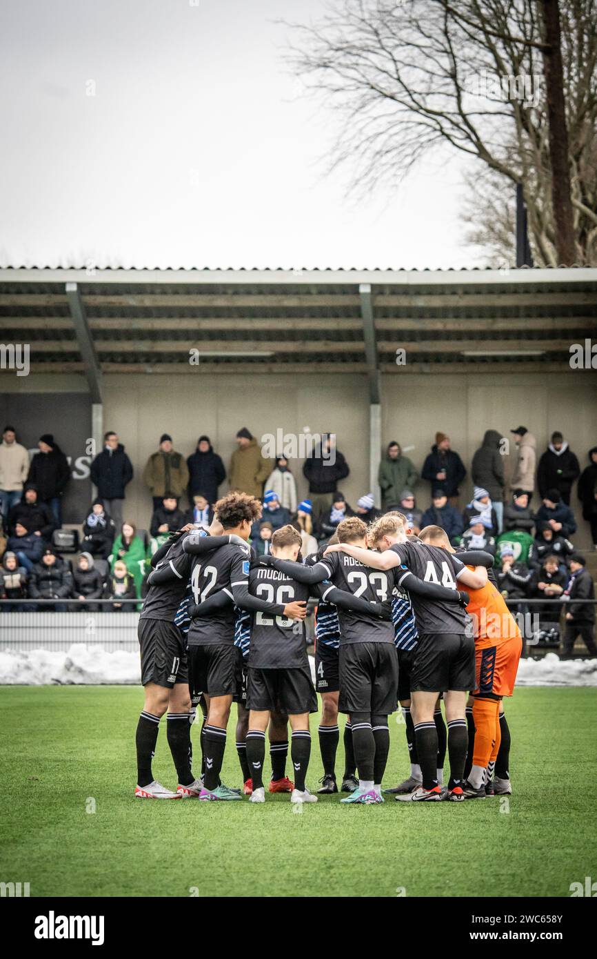 Kolding, Denmark. 13th, January 2024. The players of Odense BK unite in ...