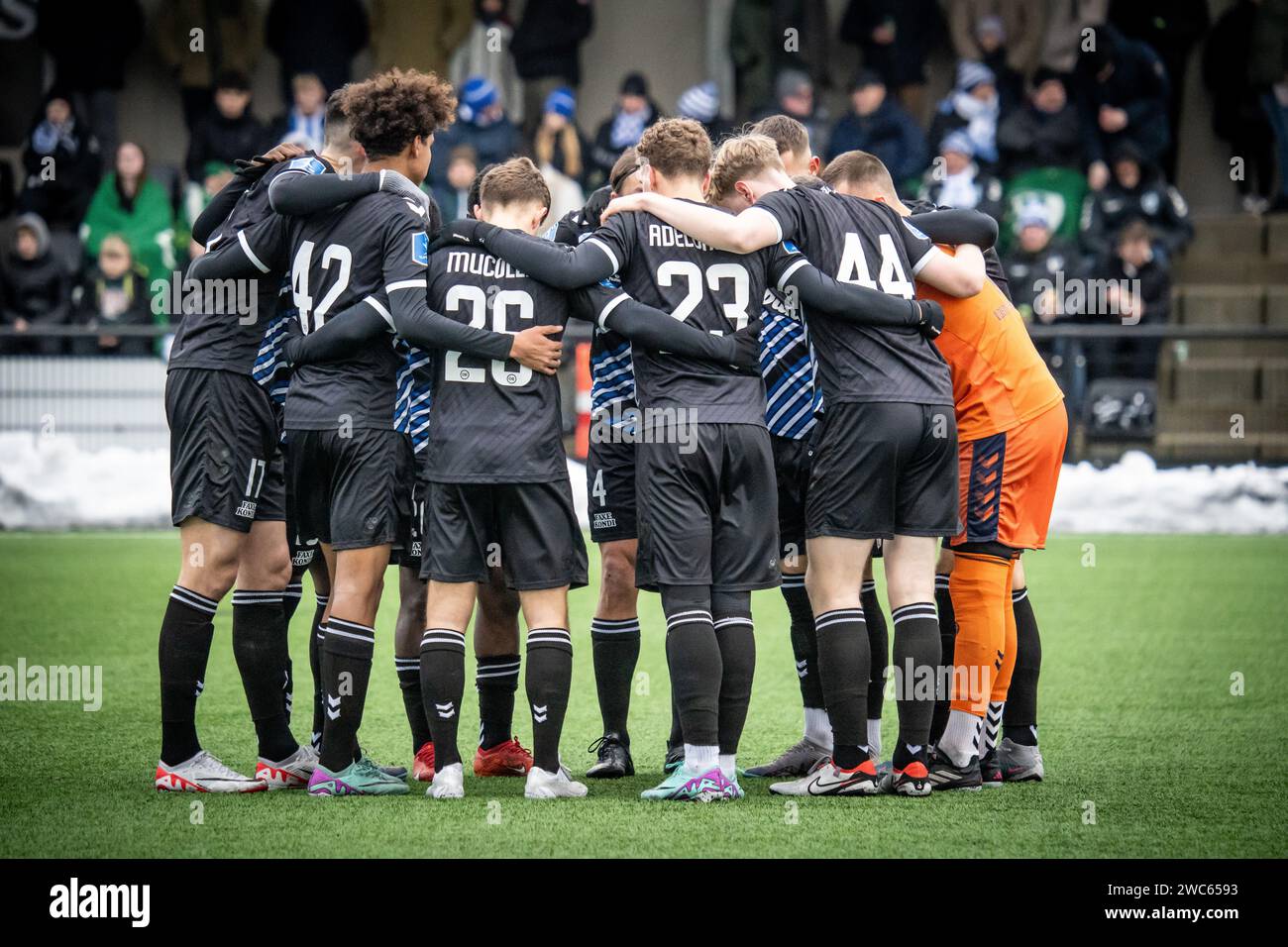 Kolding, Denmark. 13th, January 2024. The players of Odense BK unite in ...
