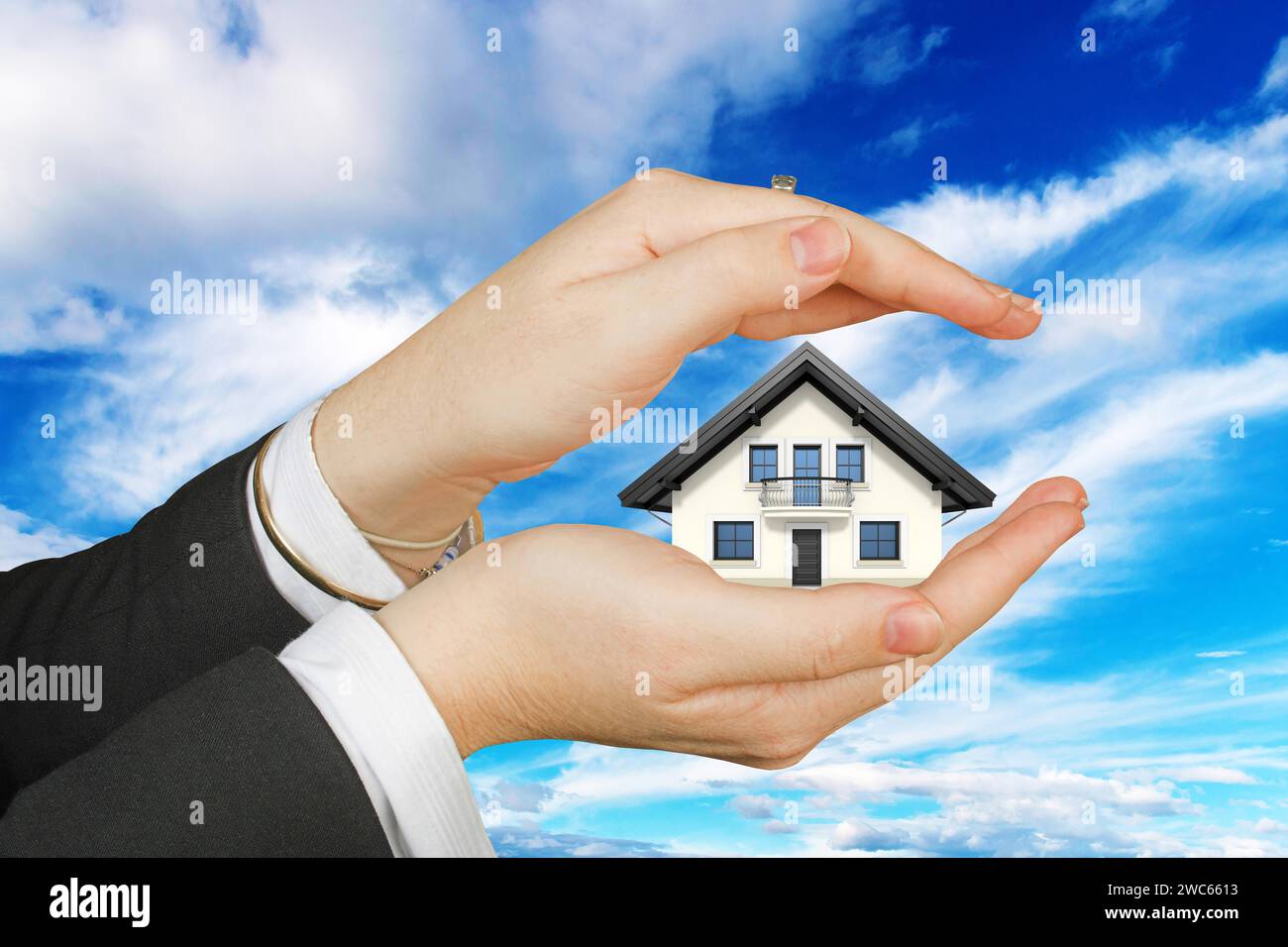 Symbol photo, Two hands protect a home, Women's hands, Studio Stock ...