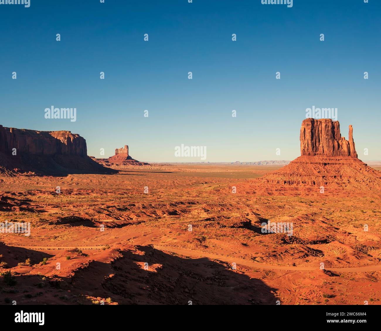 Monument valley landscape, Utah, USA, clear blue sky and long shadows ...