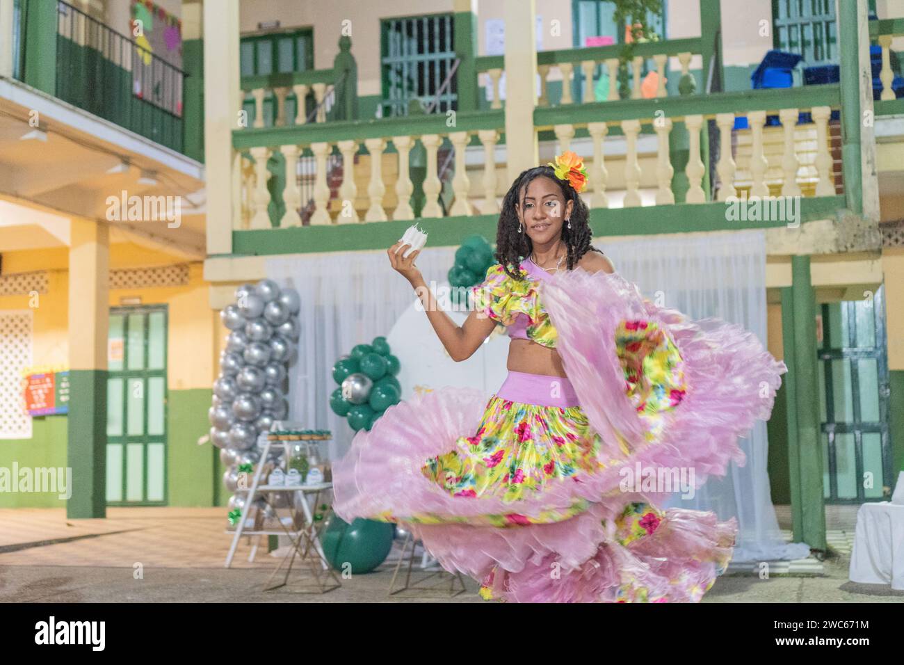 Young woman captured mid-twirl in a traditional Cumbia dance Stock ...