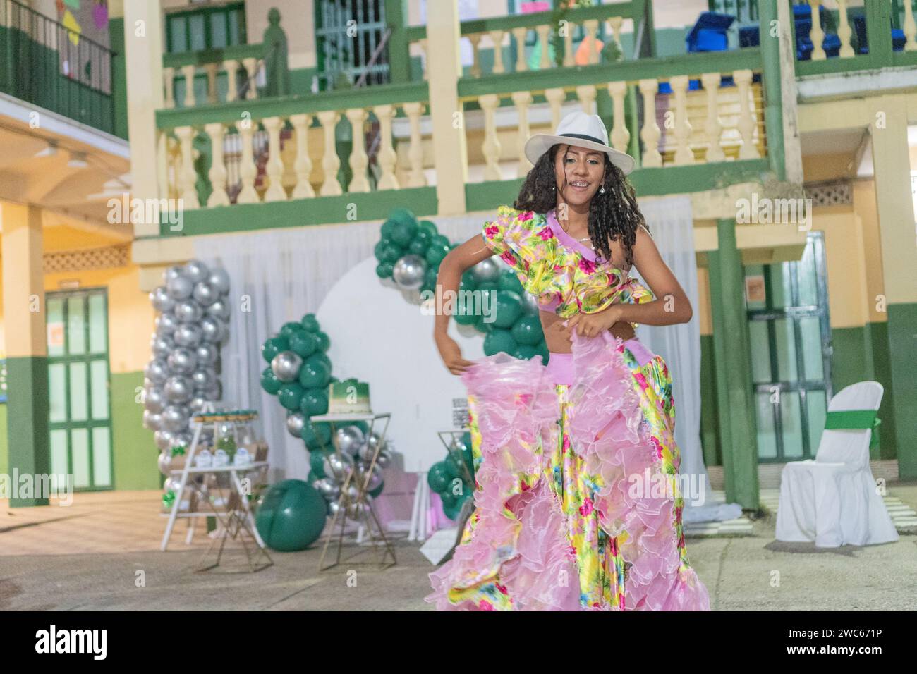 Radiant woman performing Cumbia dance, her floral dress swirling ...