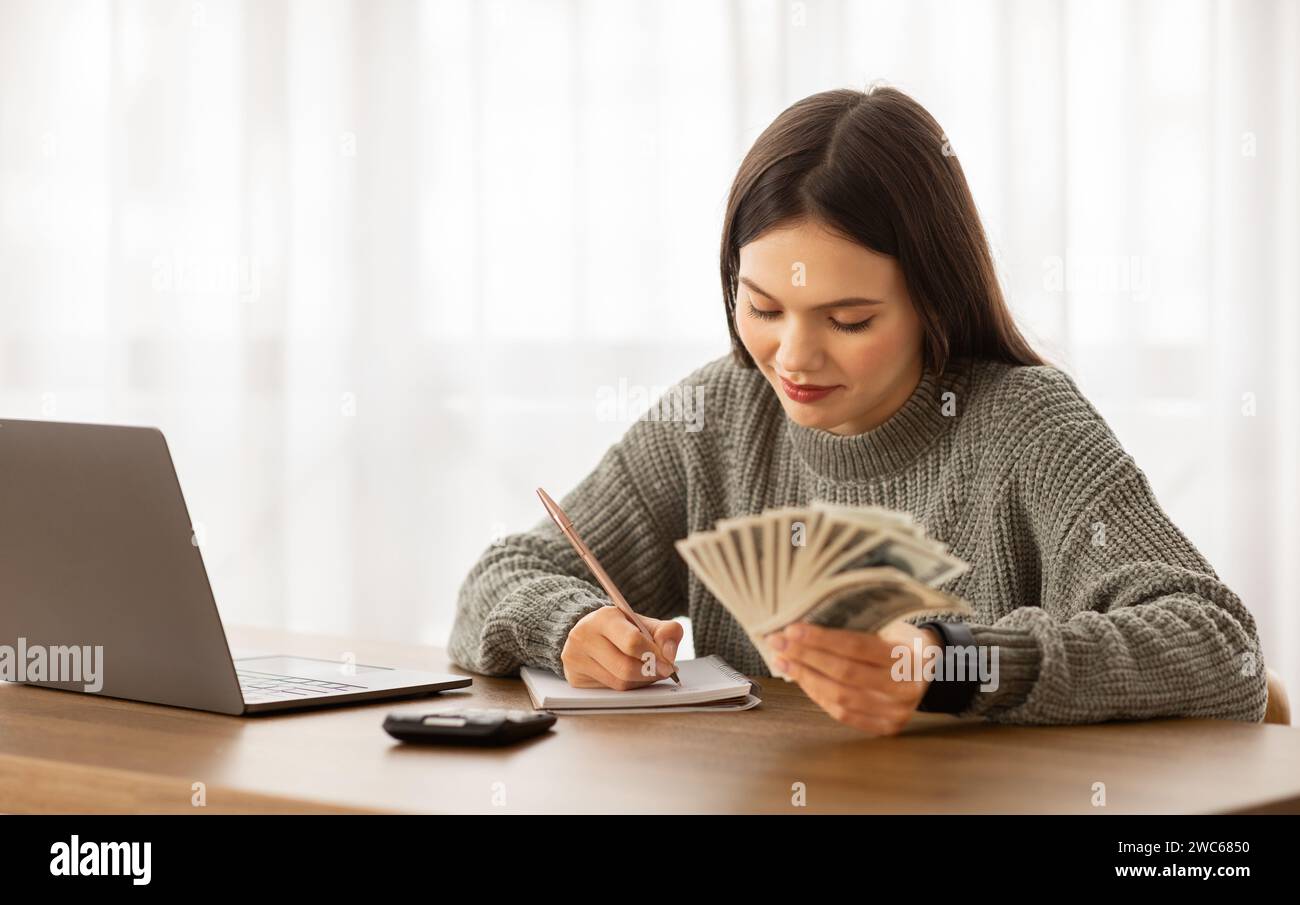 Young brunette woman counting money hi-res stock photography and images ...