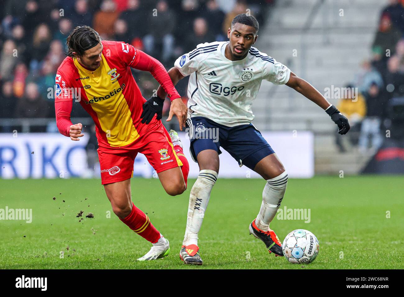 DEVENTER, NETHERLANDS - JANUARY 14: Willum Willumsson of Go Ahead Eagles, Jorrel Hato of AFC ...