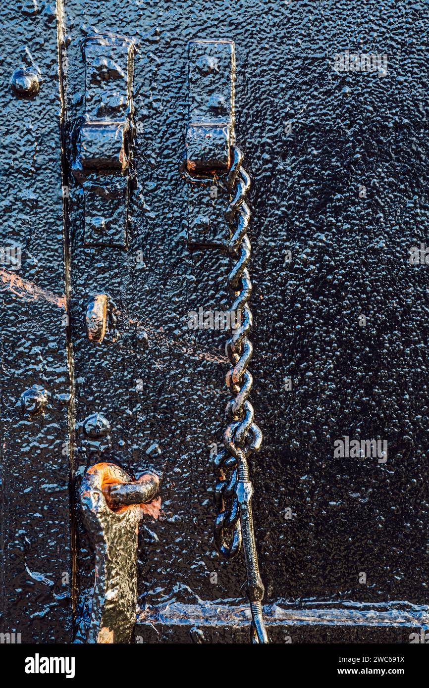 Detail of lock with chain of metal door in Red Hook, Brooklyn, New York ...