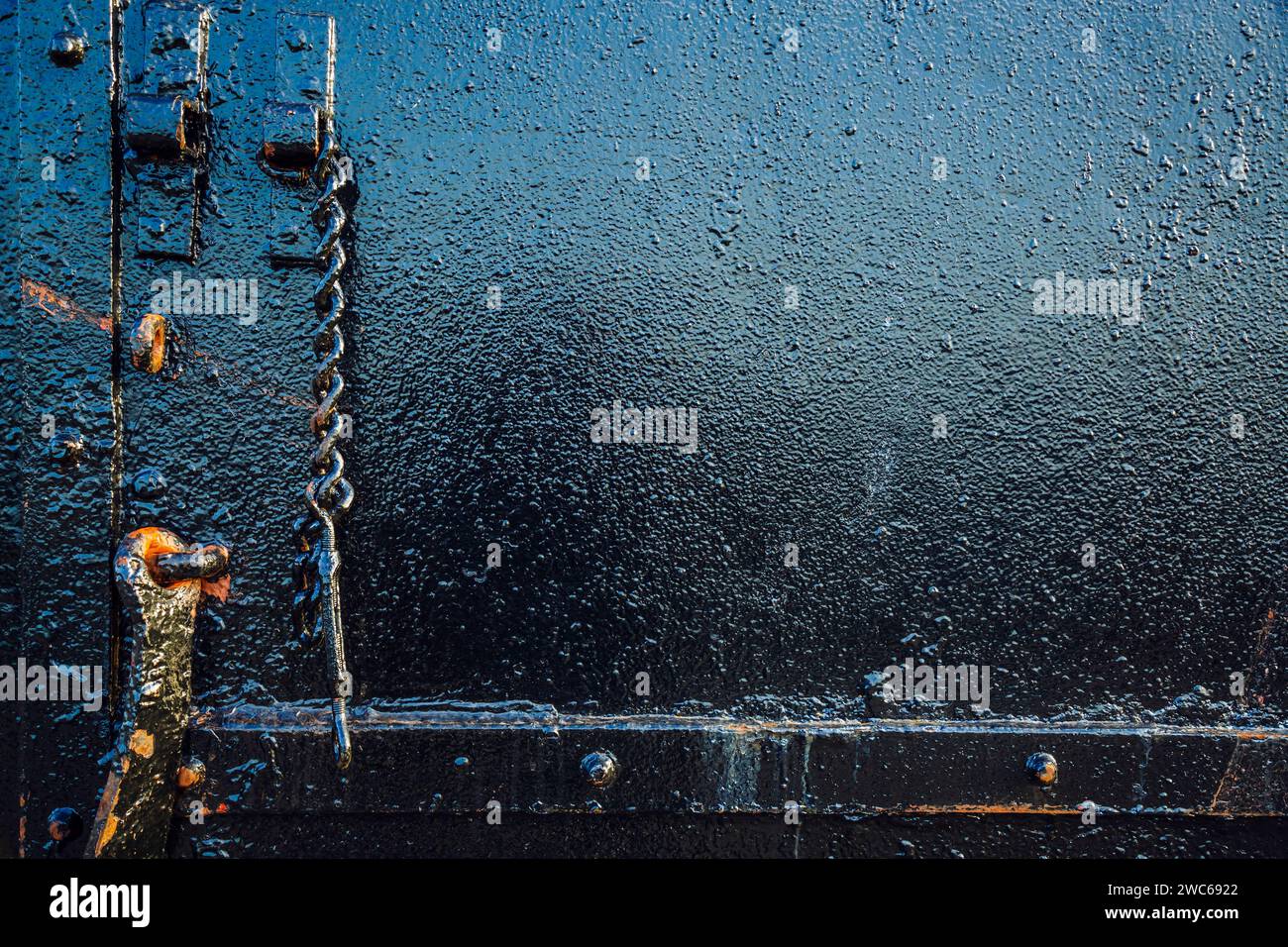 Detail of lock with chain of metal door in Red Hook, Brooklyn, New York ...