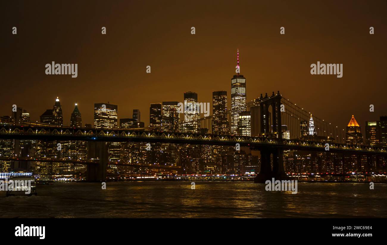 View of Manhattan from Brooklyn bride by night, New York City, USA ...