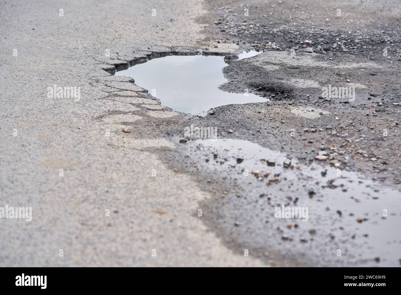Pothole filled with water hi-res stock photography and images - Alamy