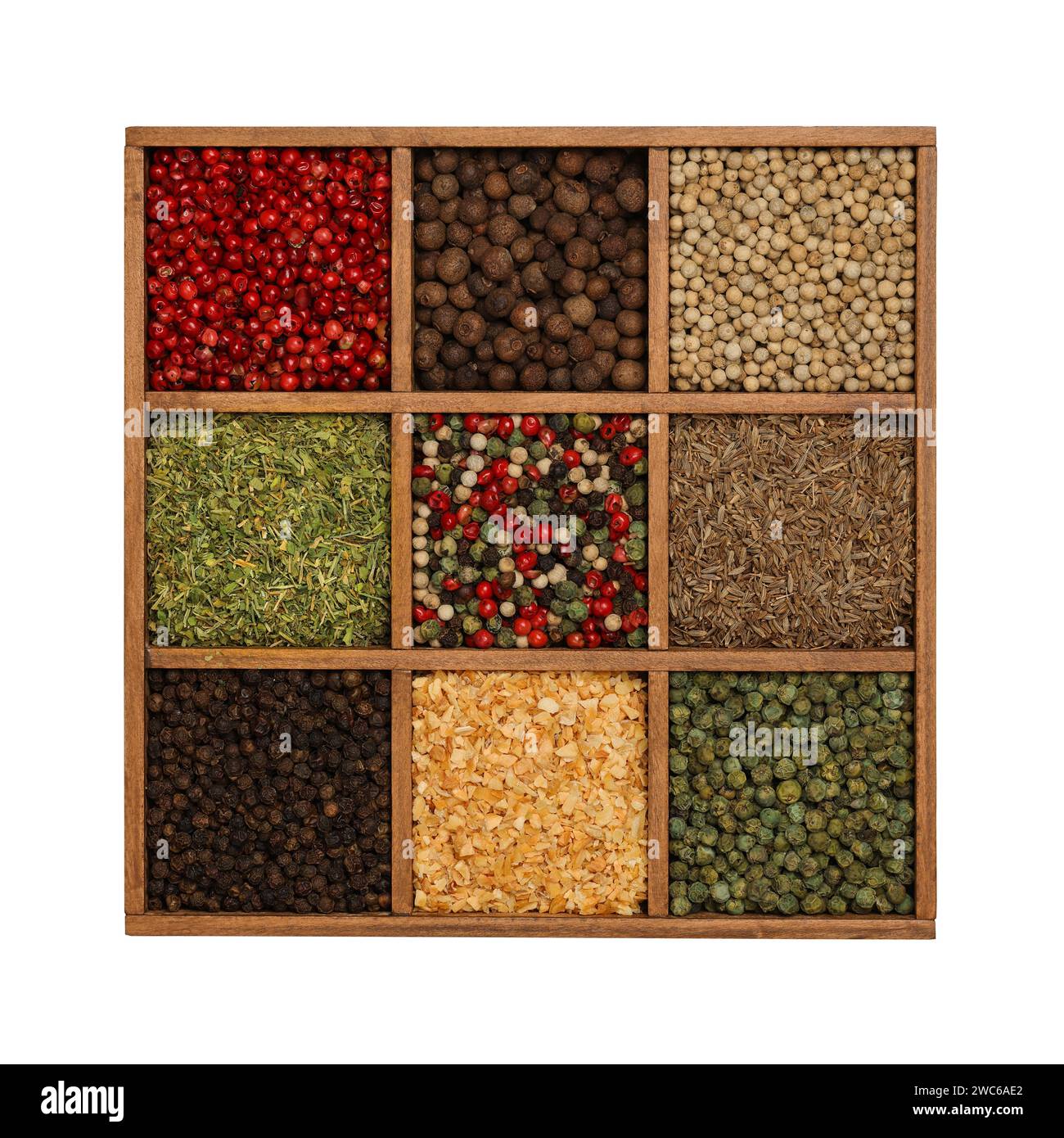 Assorted fresh colorful spices and condiments in a wooden organizer box ...