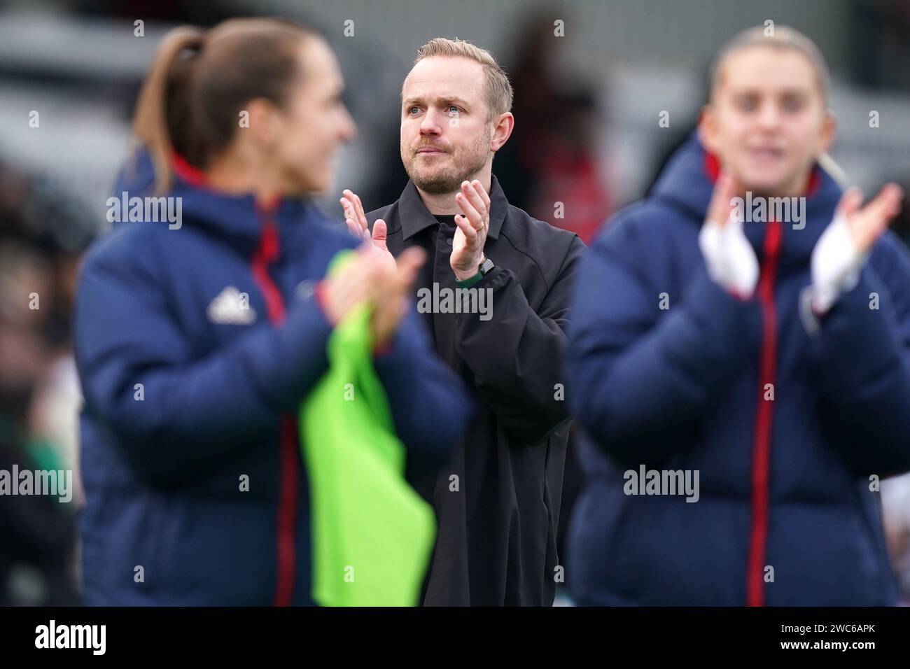 Arsenal manager Jonas Eidevall (centre) applauds the fans after the ...