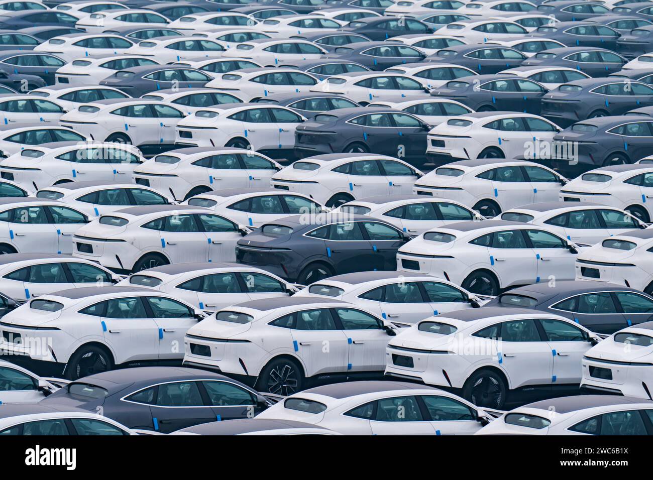 CHONGQING, CHINA - JANUARY 14, 2024 - Rows of new energy vehicles ...
