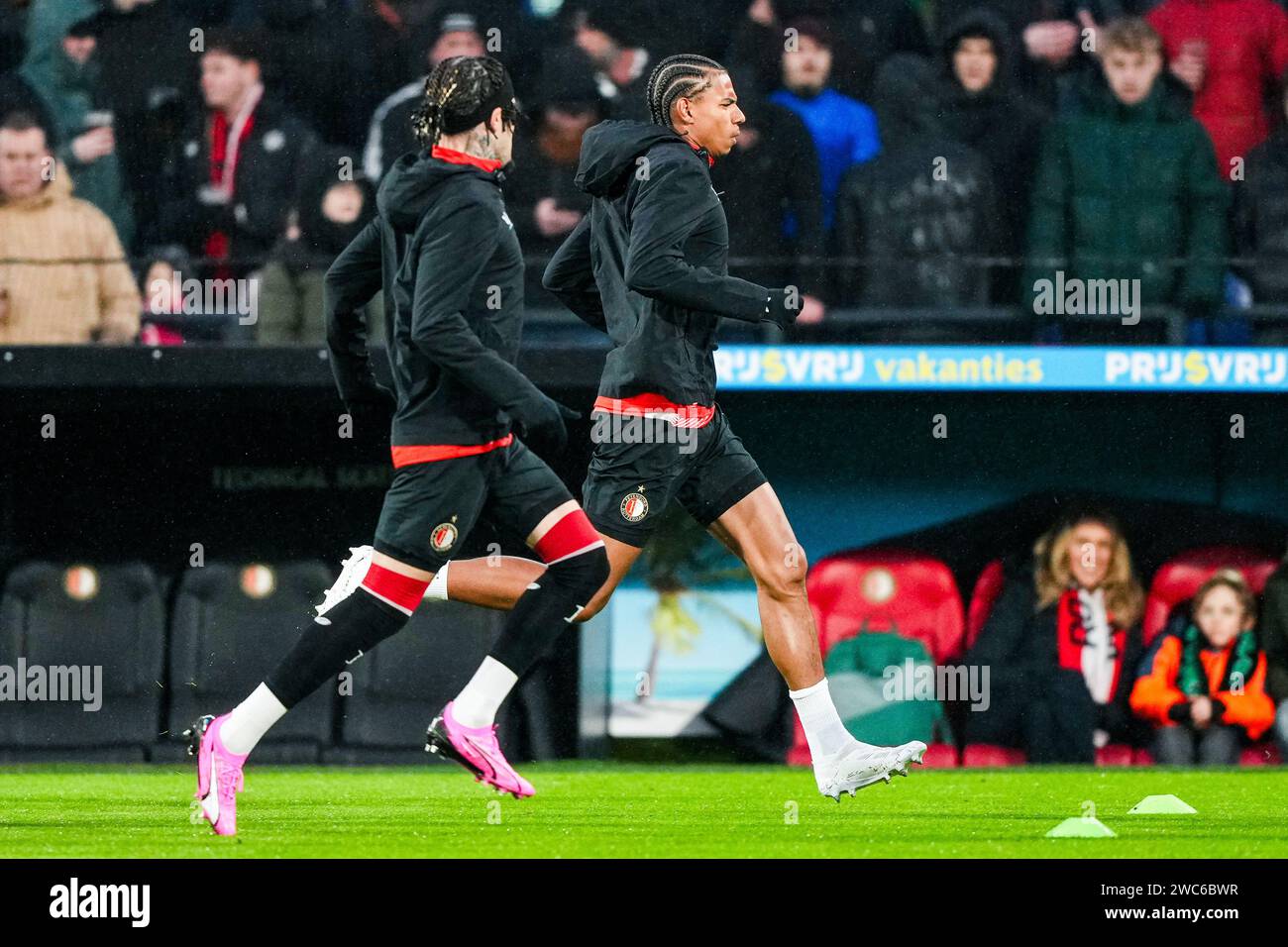 Rotterdam, The Netherlands. 14th Jan, 2024. Rotterdam - Quilindschy Hartman of Feyenoord, Calvin ...
