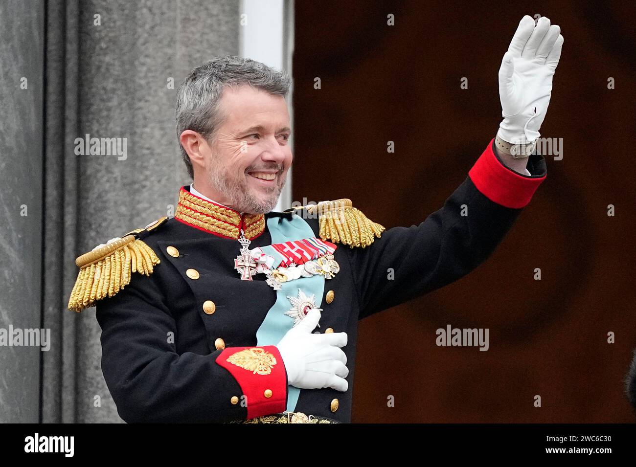 Denmark's King Frederik X waves from the balcony of Christiansborg ...