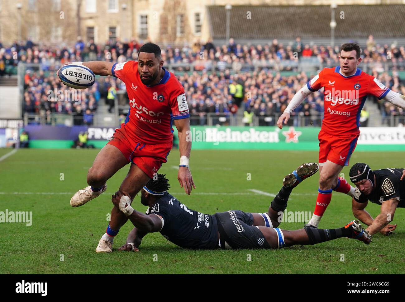 Bath's Joe Cokanasiga gets past the tackle of Racing 92's Siya Kolisi ...