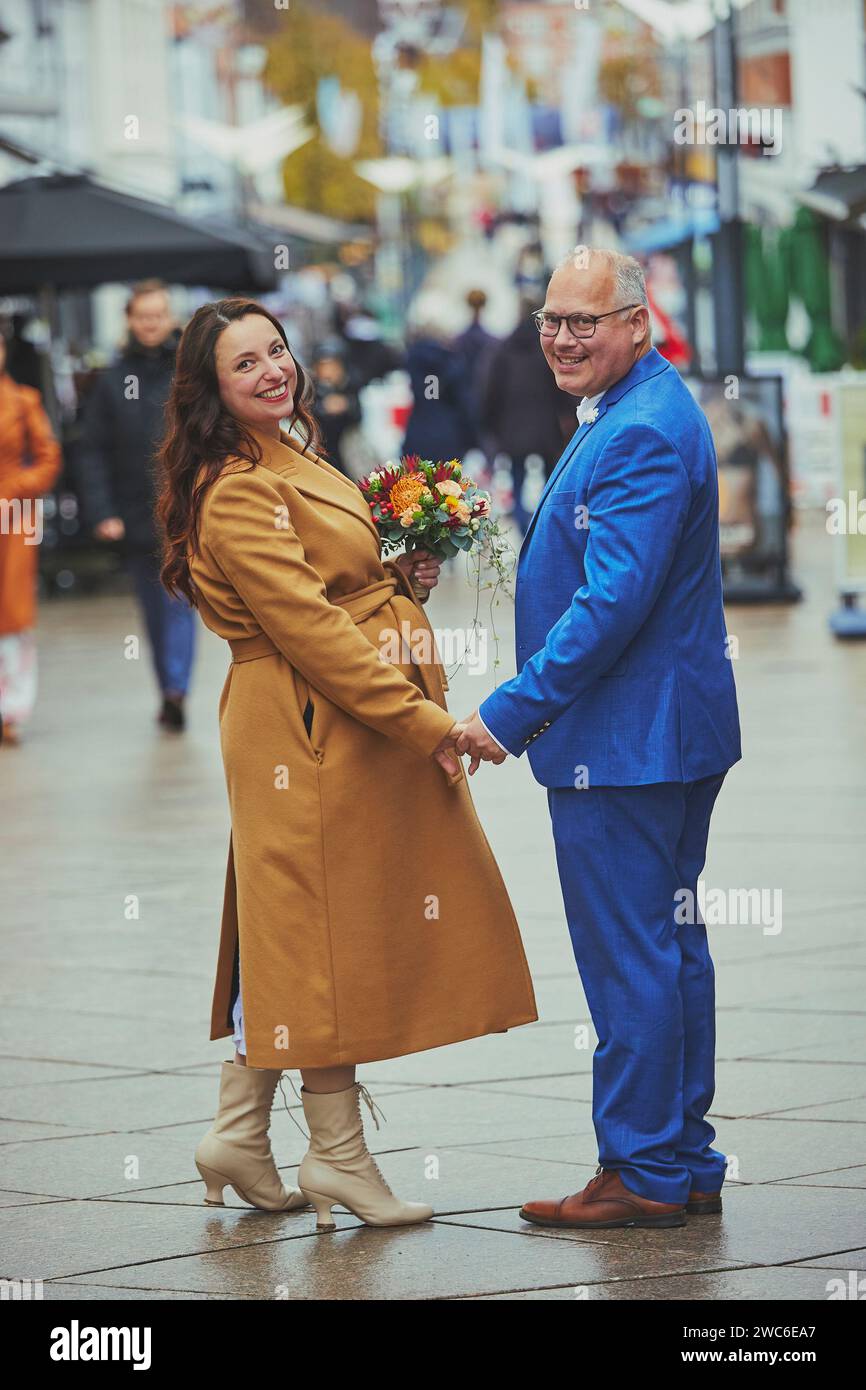 Vejle, Denmark, October 26, 2023: Couple in love walking in the city ...