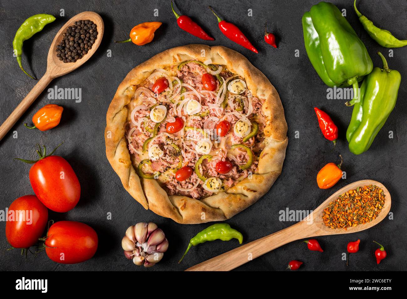 Artisanal pizza. Top view of delicious rustic pizza with ingredients ...