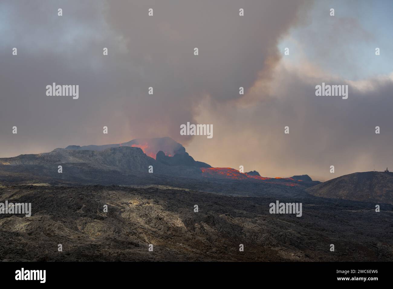 View across a hardened black grey lava field. Through shimmering hot ...