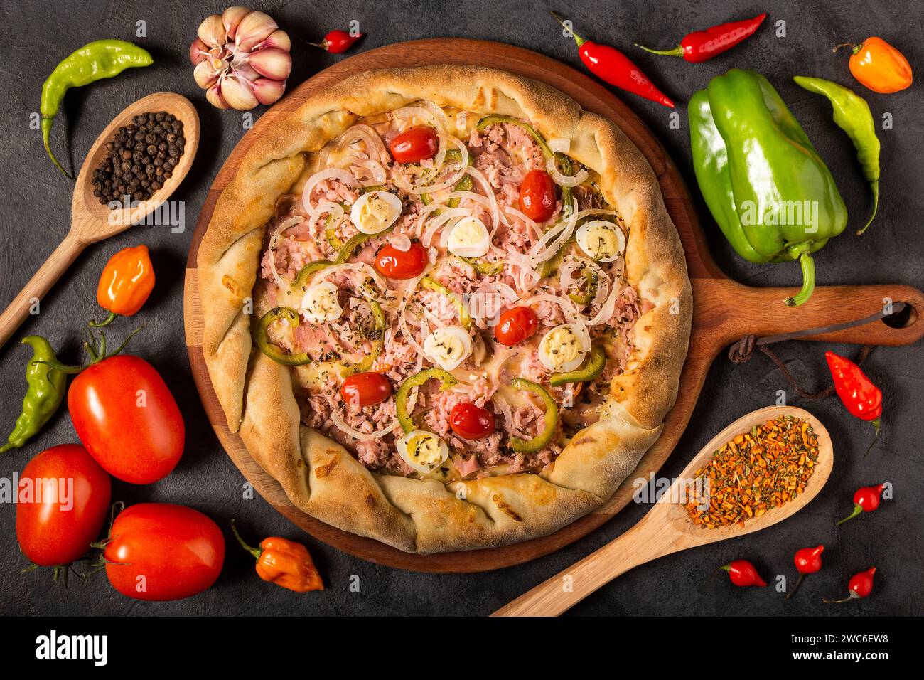 Artisanal pizza. Top view of delicious rustic pizza with ingredients ...
