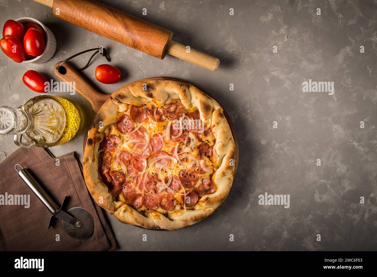 Artisanal pizza. Top view of delicious rustic pizza Stock Photo - Alamy