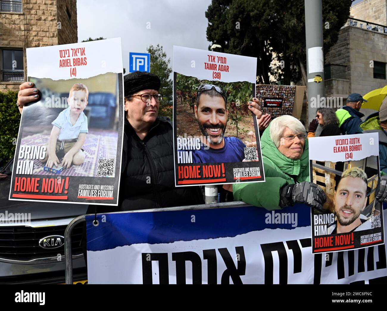 Jerusalem, Israel. 14th Jan, 2024. A woman holds posters of Israeli ...