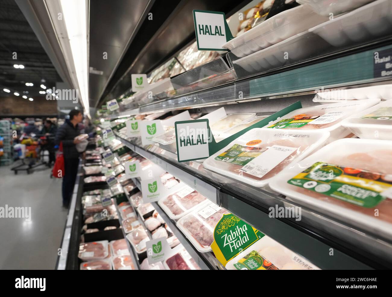 People shop near the halal food section inside a Metro grocery store in ...