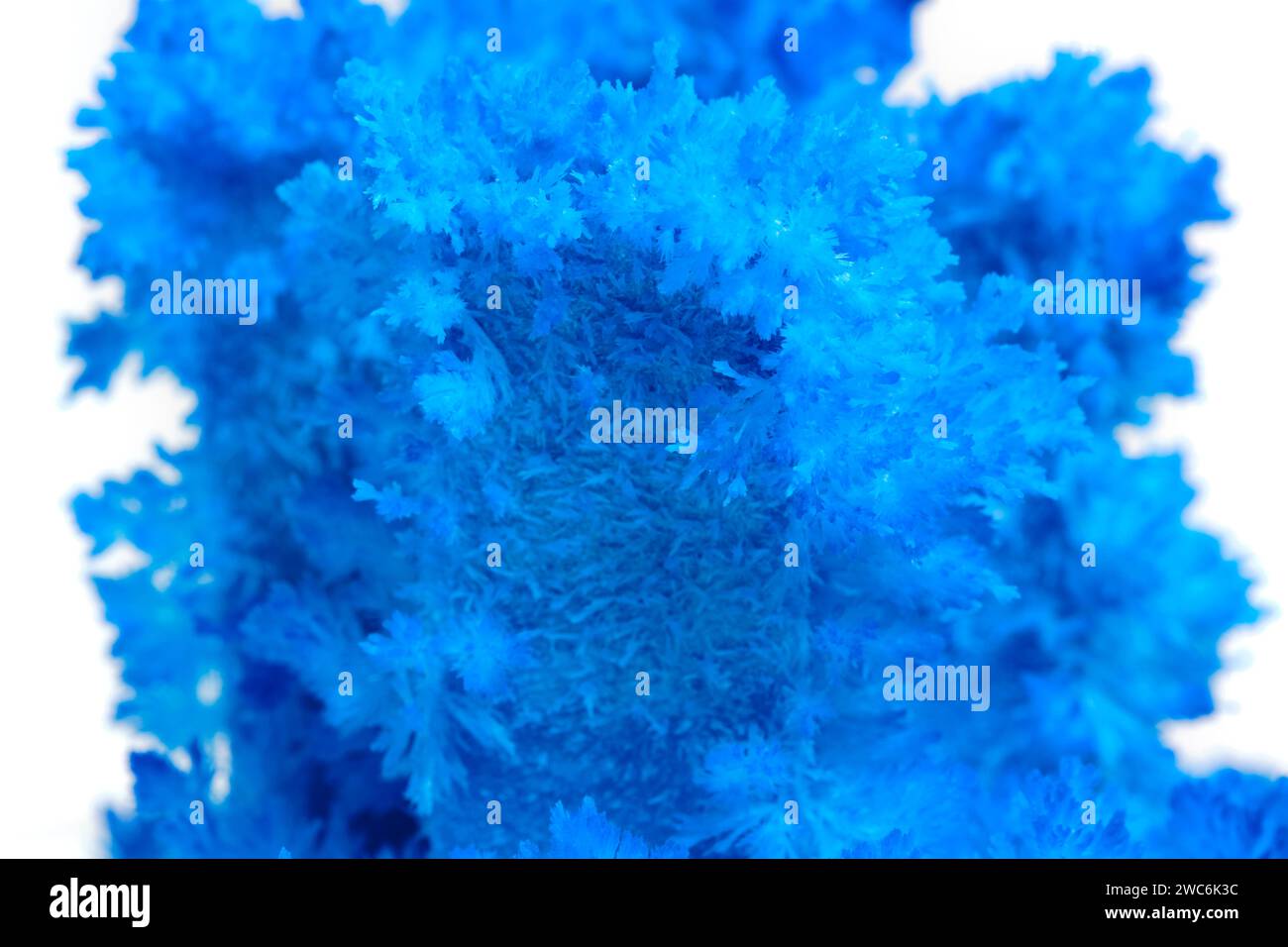 Macro image blue salt crystal on white background Stock Photo - Alamy