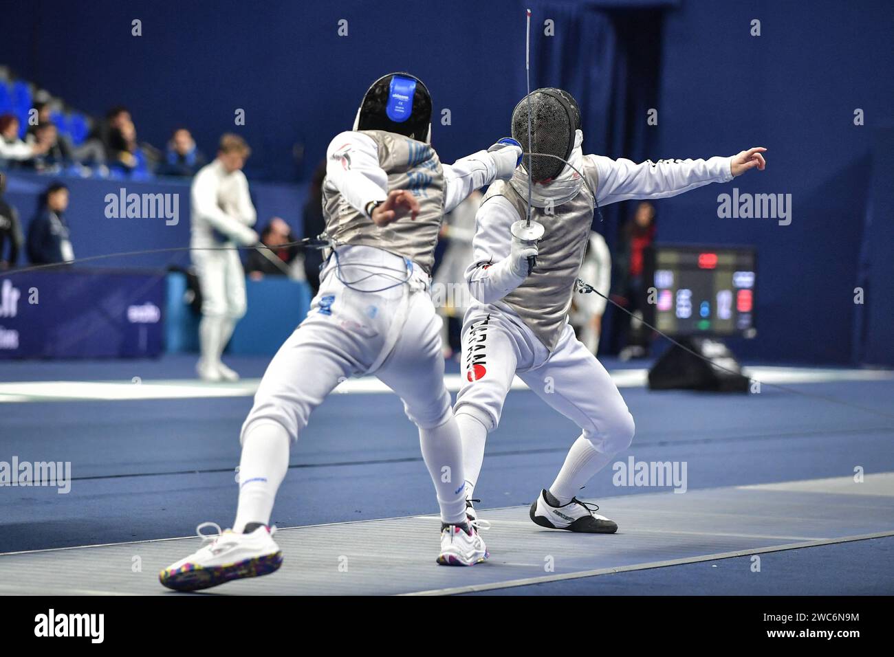 Egypt's foilist ABDELRAHMAN TOLBA (L) competes against Japan's foilist ...