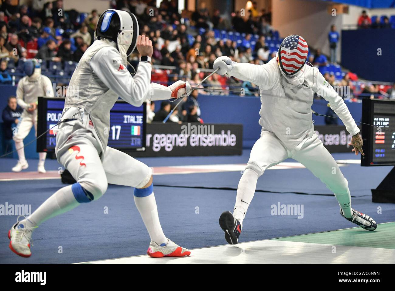 USA foilist MILES CHAMLEY-WATSON (R) competes against China's foilist ...