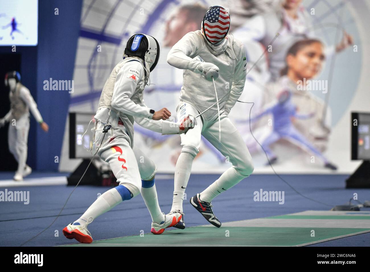 USA foilist MILES CHAMLEY-WATSON (R) competes against China's foilist ...