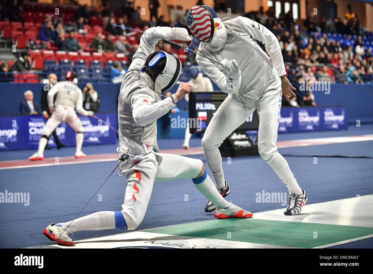 USA foilist MILES CHAMLEY-WATSON (R) competes against China's foilist ...
