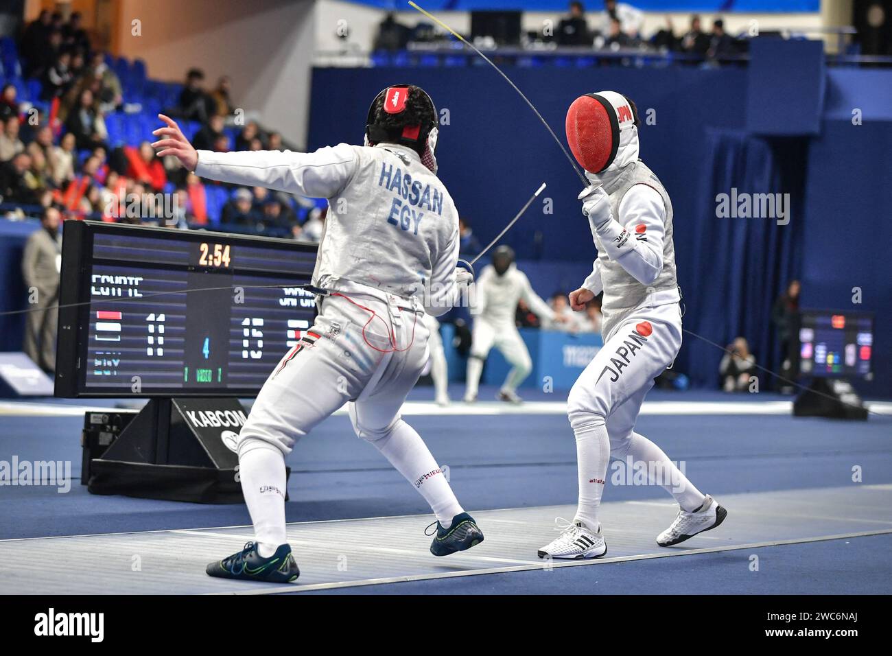Egypt's foilist MOHAMED HASSAN (L) competes against Japan's foilist ...