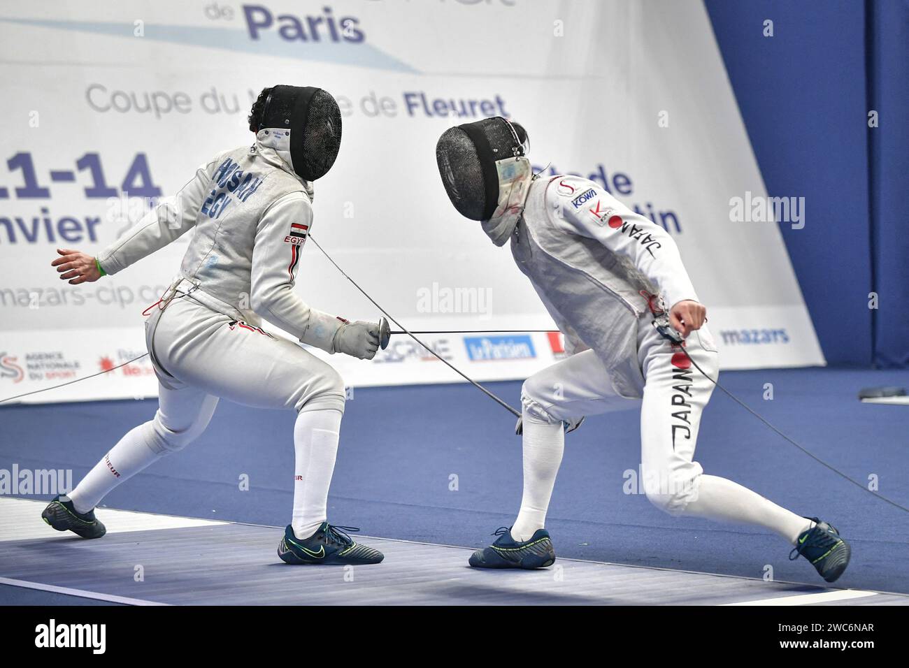 Egypt's foilist MOHAMED HASSAN (L) competes against Japan's foilist ...