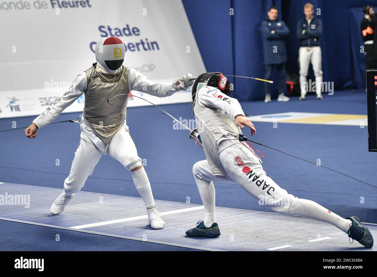 Egypt's foilist MOHAMED HAMZA (L) competes against Japan's foilist ...