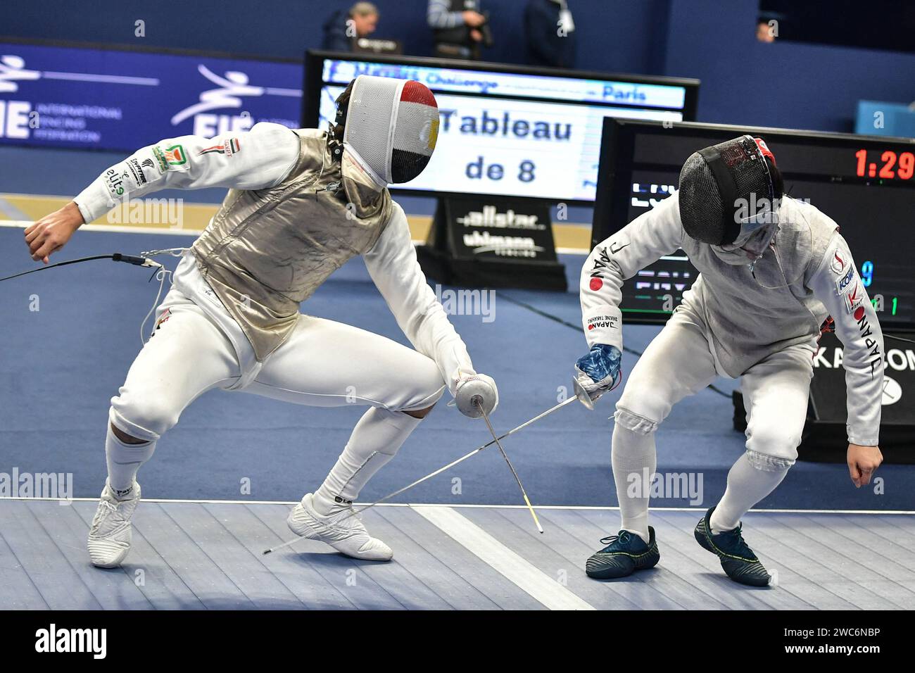 Egypt's foilist MOHAMED HAMZA (L) competes against Japan's foilist ...