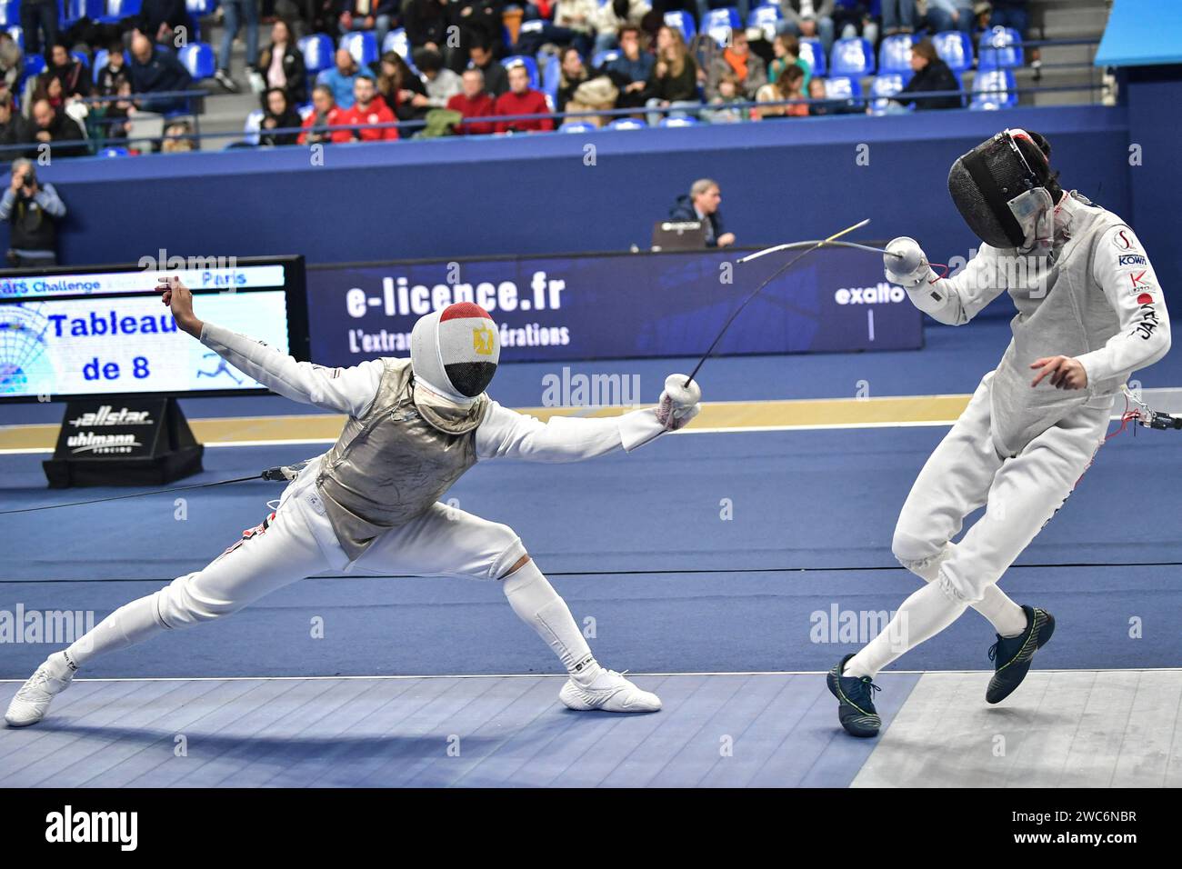 Egypt's foilist MOHAMED HAMZA (L) competes against Japan's foilist ...